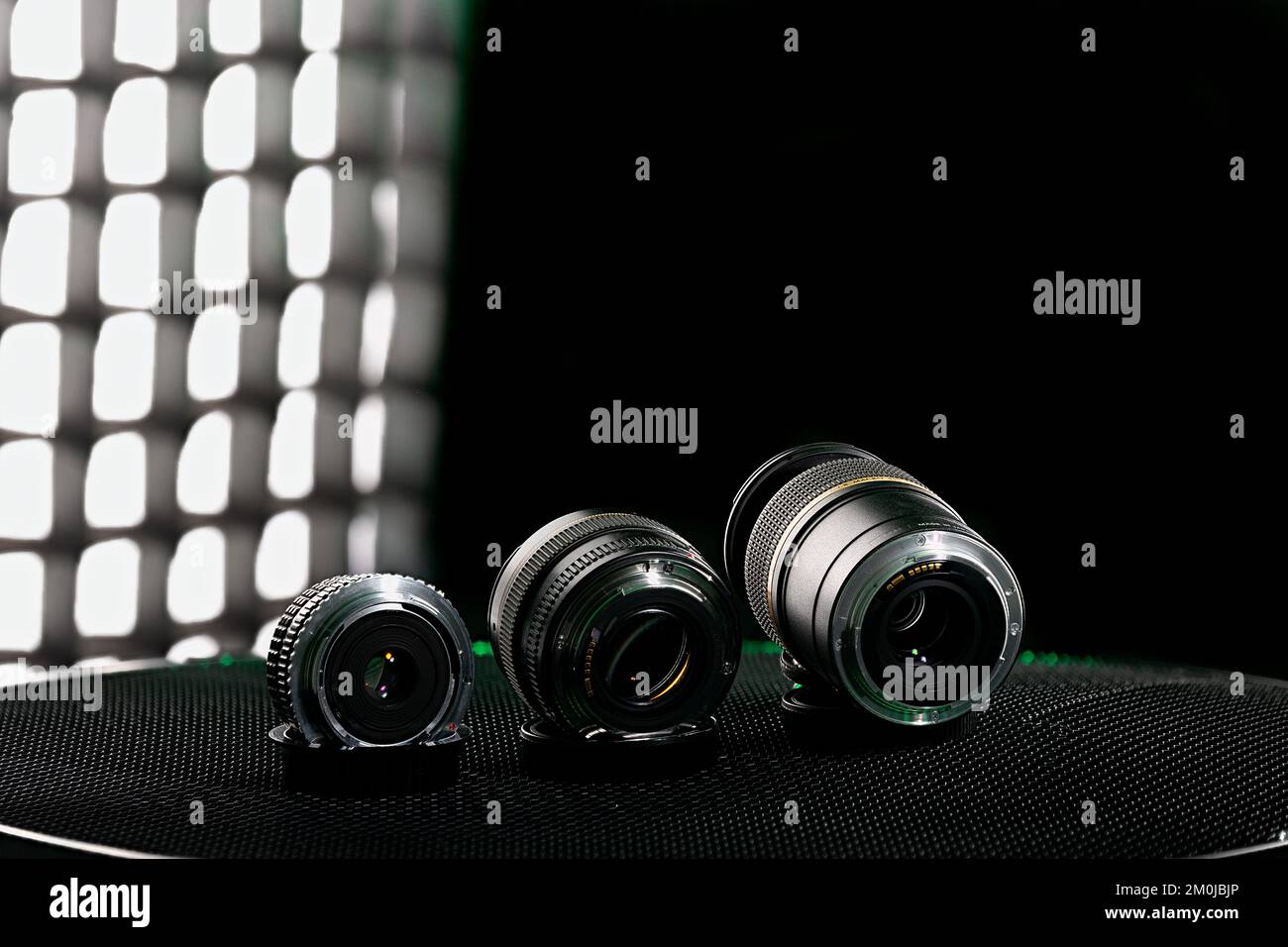 Camera lenses taken in a photo studio (28mm - 50mm 90mm Stock Photo - Alamy
