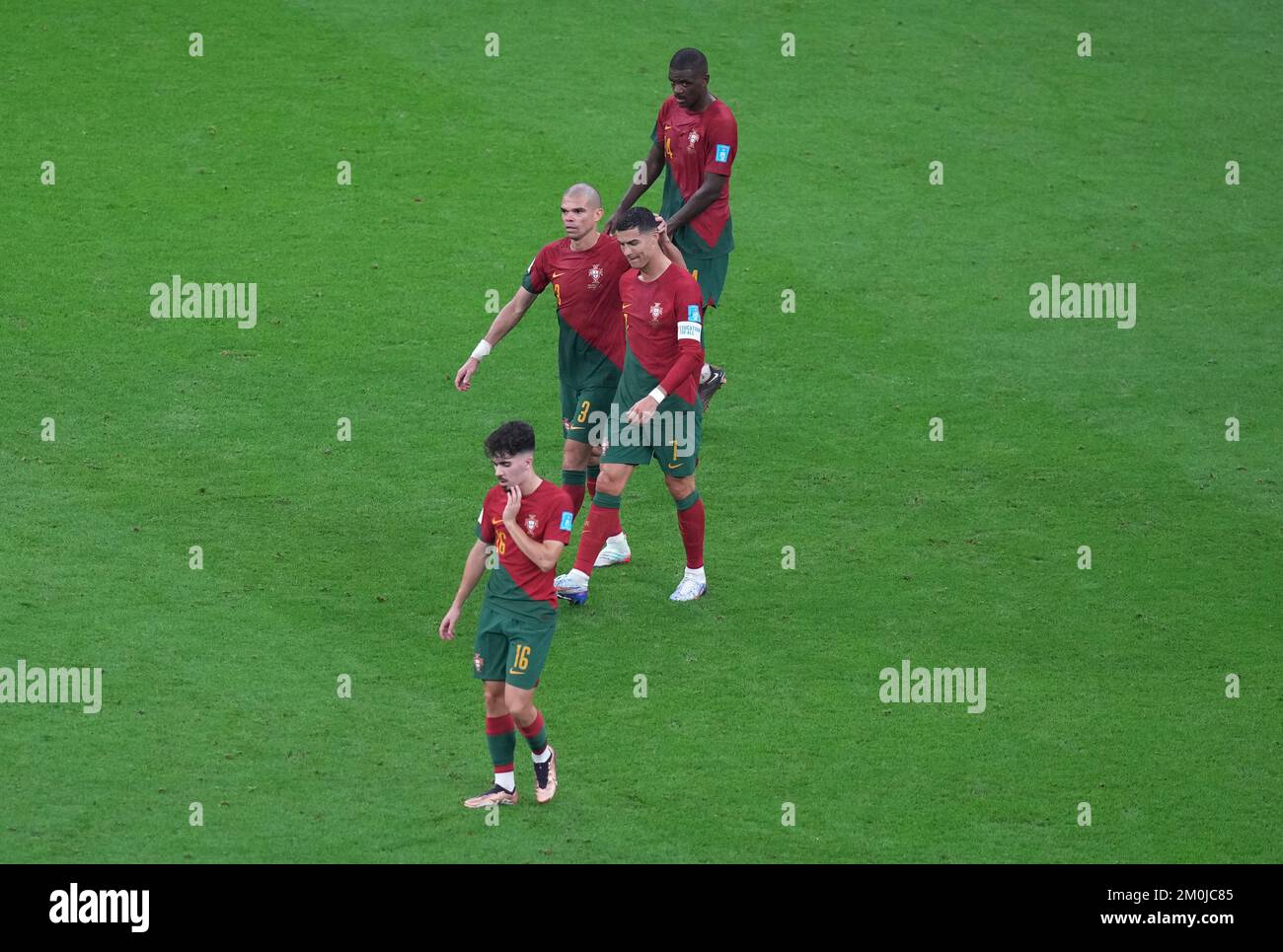 Portugal's Pepe (left) and Portugal's Cristiano Ronaldo react after Rafael Leao scores their ...