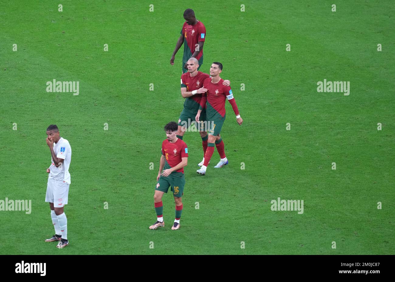Portugal's Pepe (left) and Portugal's Cristiano Ronaldo react after Rafael Leao scores their ...