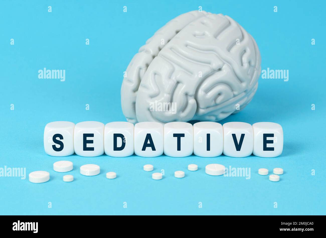 Medicine and health. Cubes lie on the table among the pills and ...