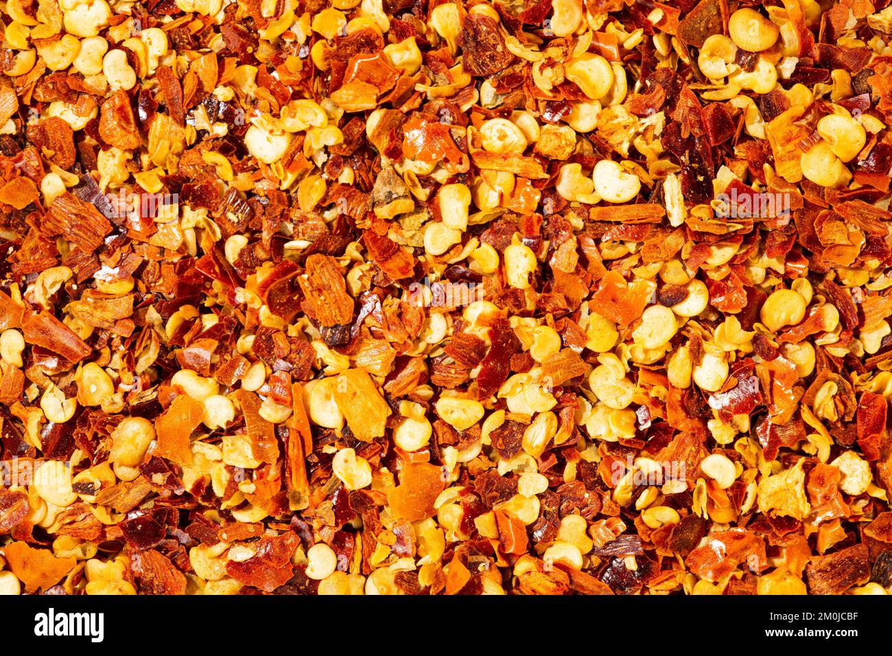 The texture of dried chilli peppers as a background. A close shot of ...