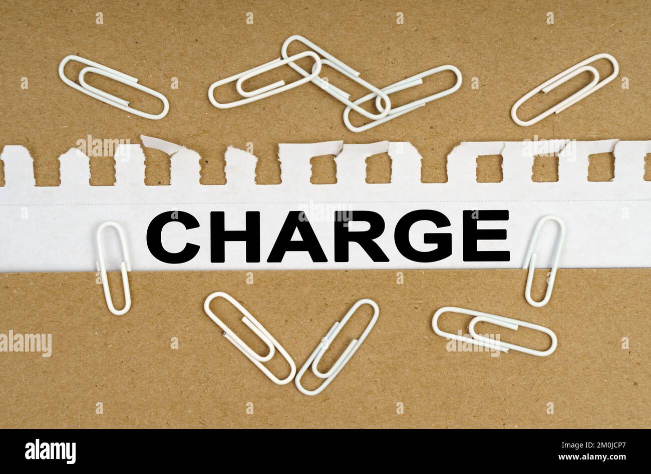 Business concept. On cardboard, white paper clips and a sheet from a ...