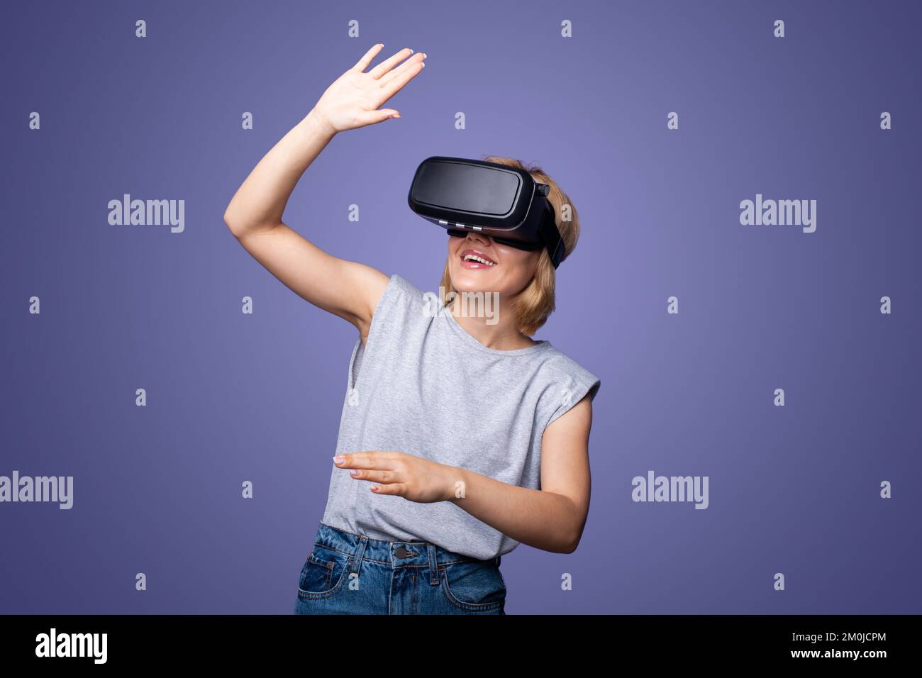 Woman in modern VR glasses having virtual reality experience isolated ...