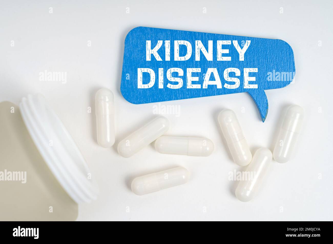 Medicine and health concept. On the table are pills and a blue sign ...