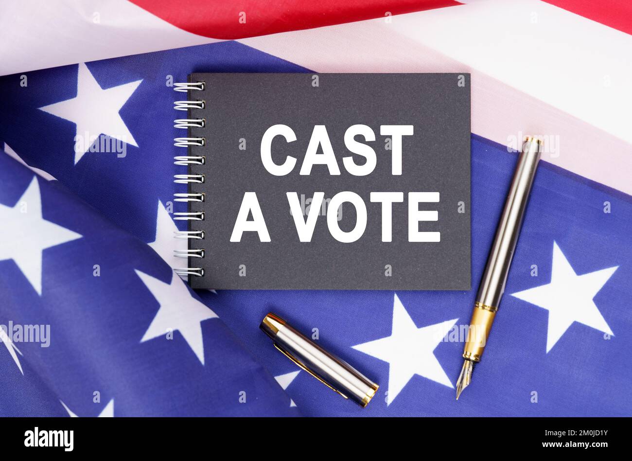 American concept. The US flag has a pen and a notebook with the ...