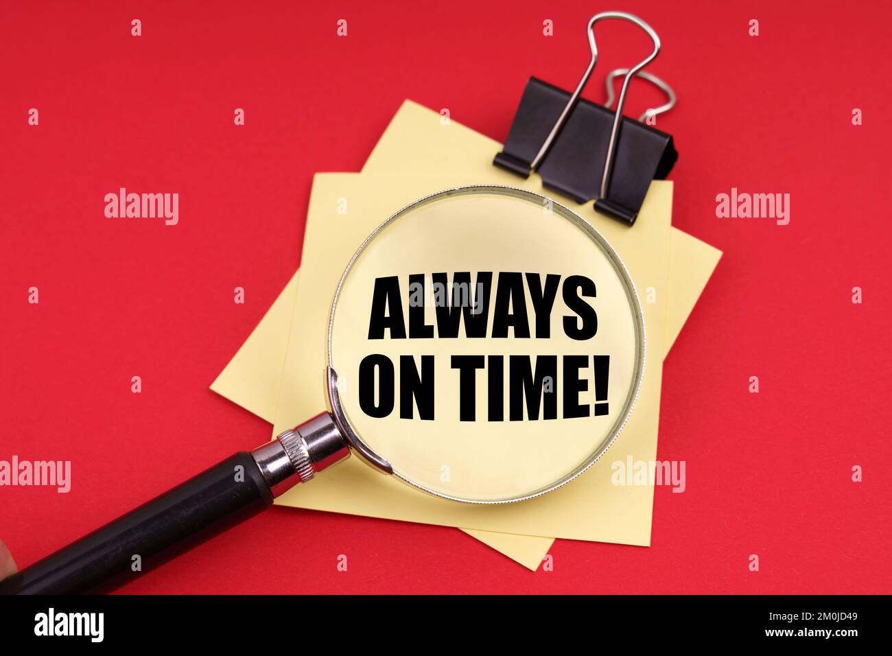 Business and Economics. On a red background, a magnifying glass and a ...
