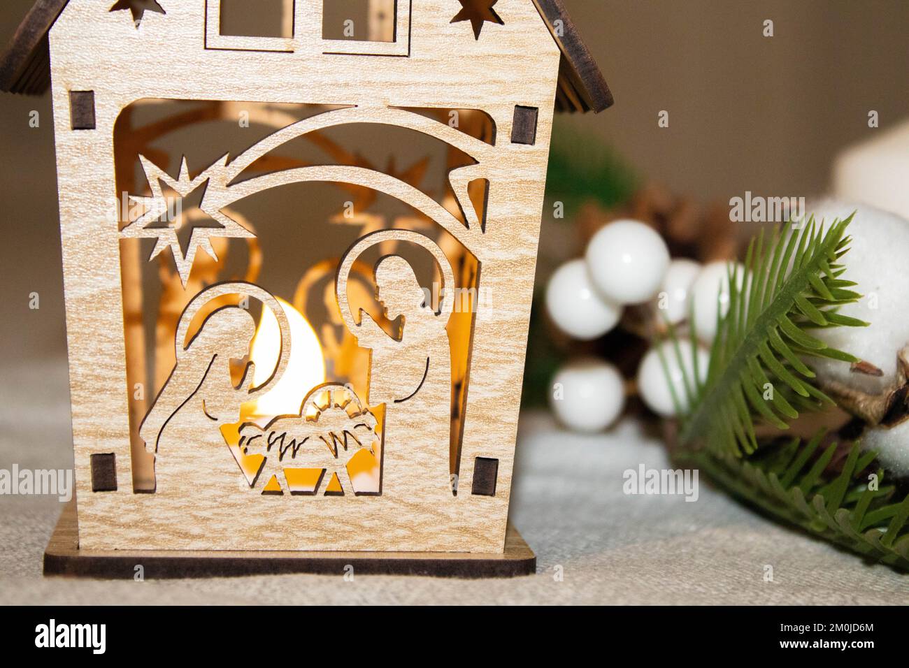Nativity scene on a hill in the snow. Joseph of Nazareth lights the ...