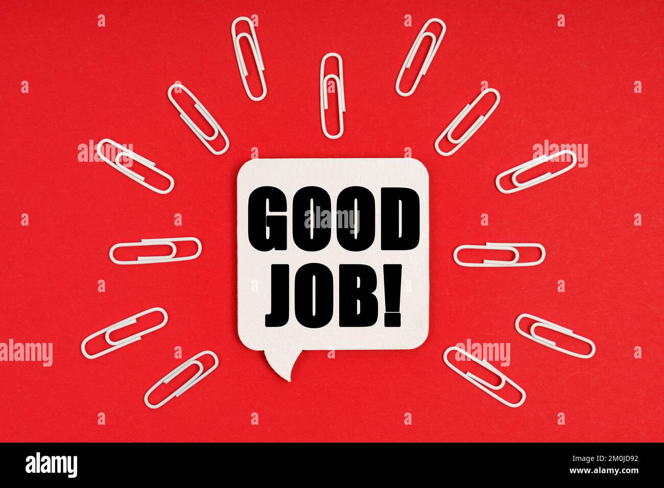 Business and finance concept. On a red background are paper clips and a ...