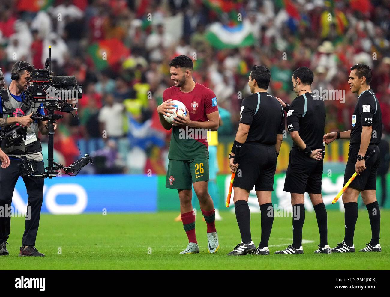 Portugal's Goncalo Ramos (centre) celebrates with his hat-trick ball ...