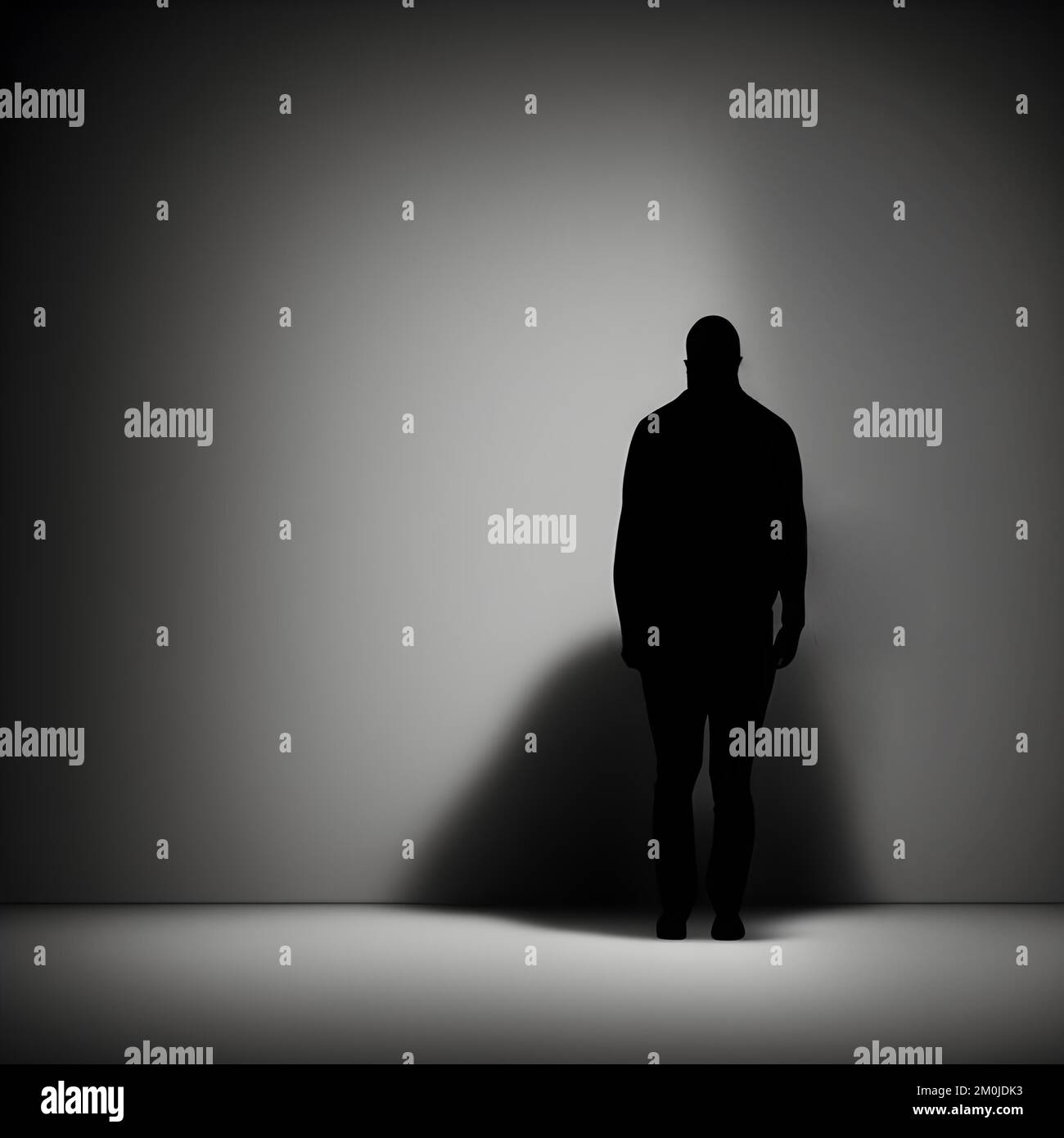 isolated man facing a wall with his shadow on the ground Stock Photo ...