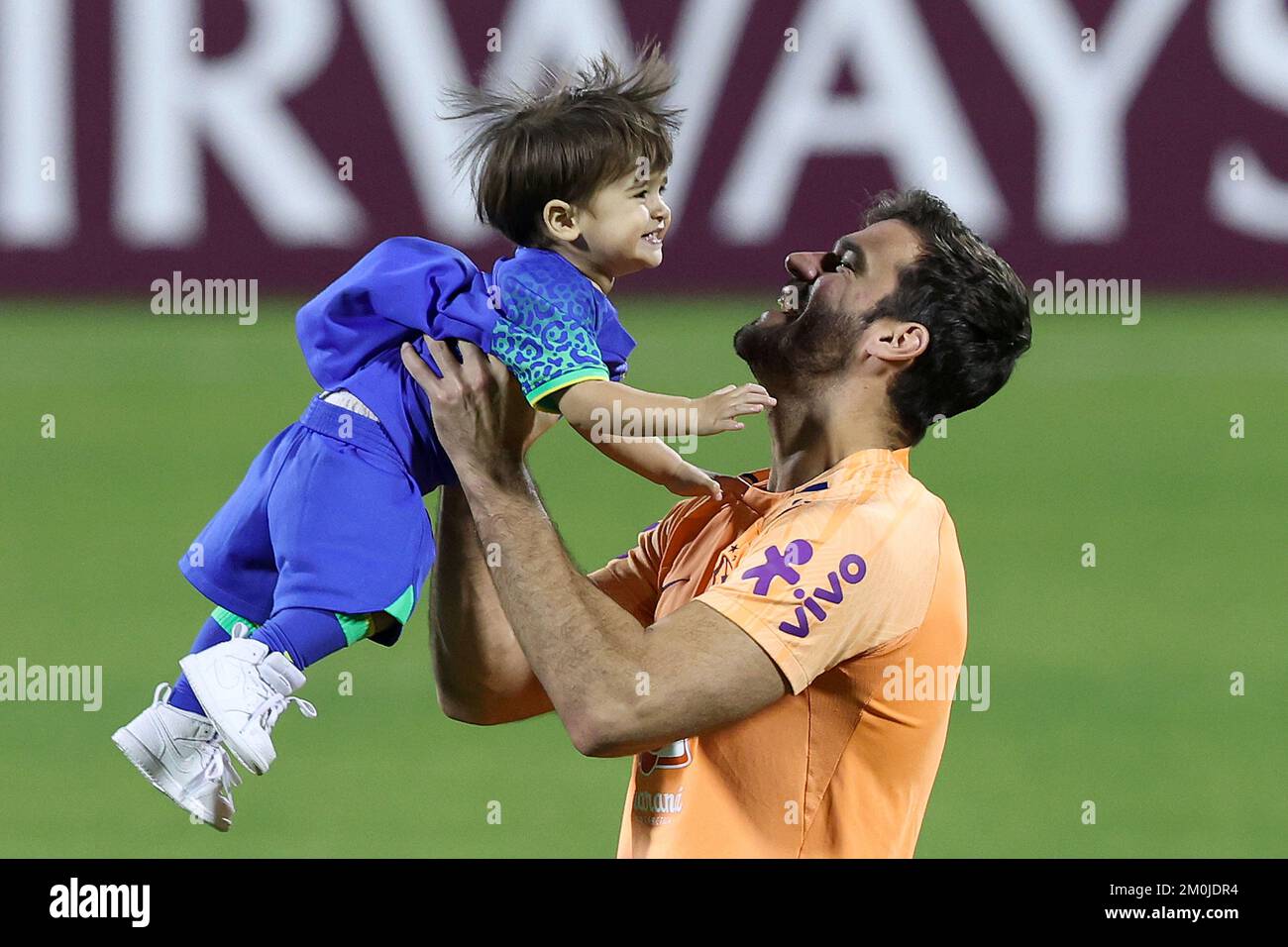 Alisson Becker of Brazil plays with children during Brazil training ...