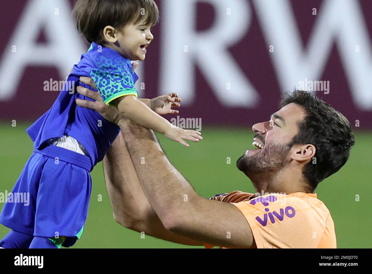 Alisson Becker of Brazil plays with children during Brazil training ...
