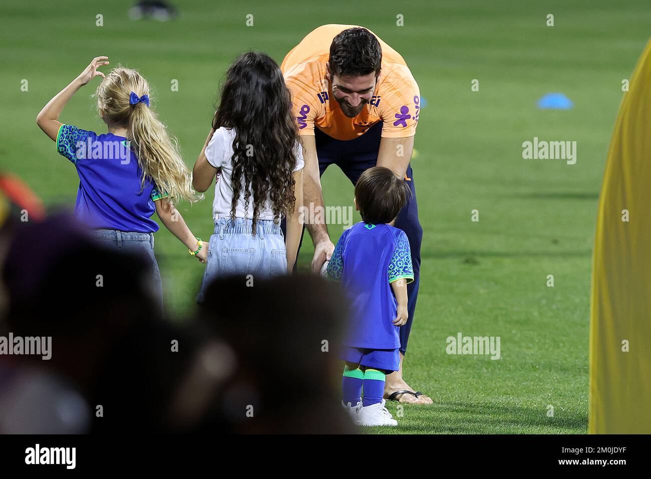 Alisson Becker of Brazil talks pwith children during Brazil training ...