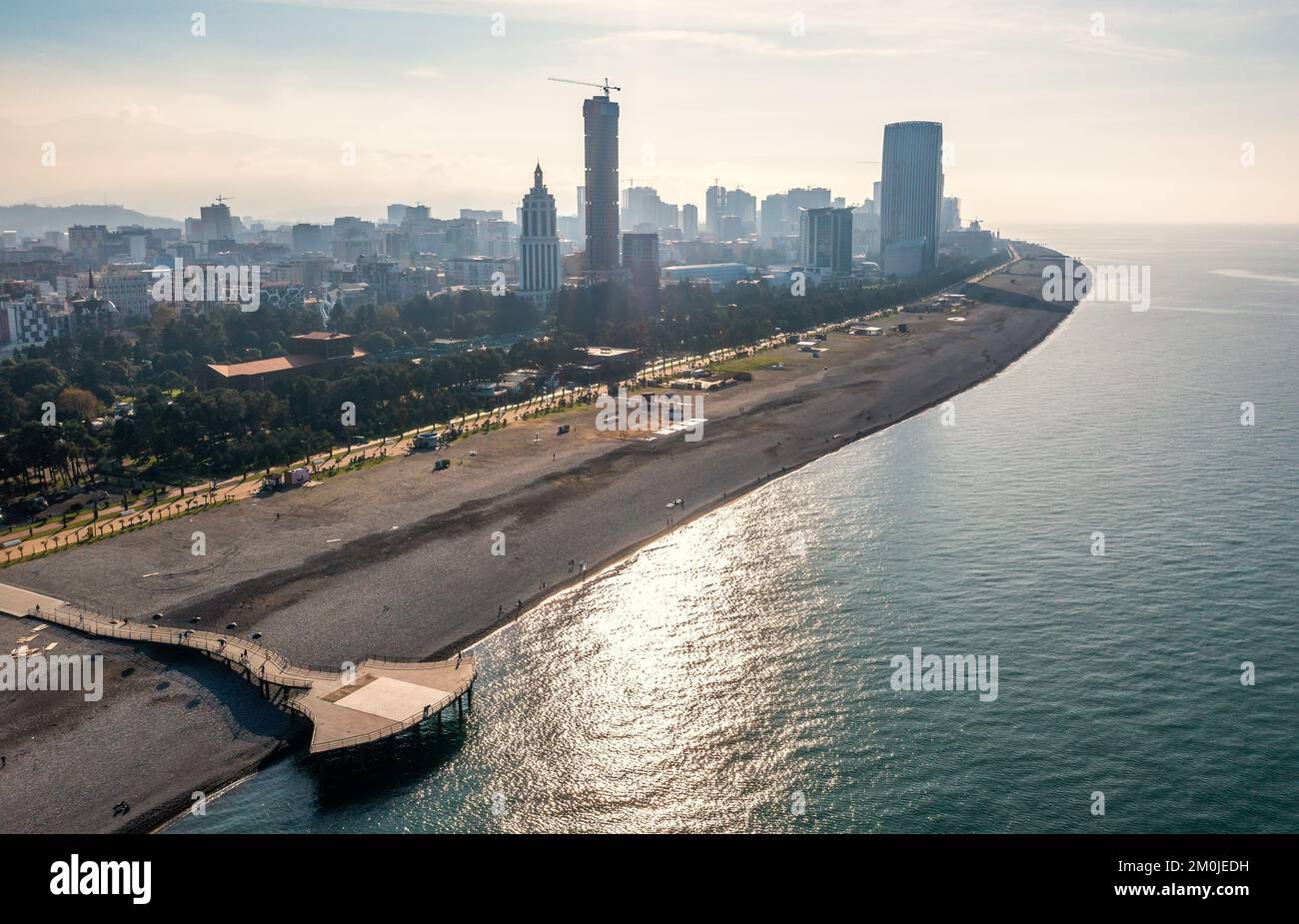 Aerial view of resort town Batumi on sunny day. Promenade, beach with ...