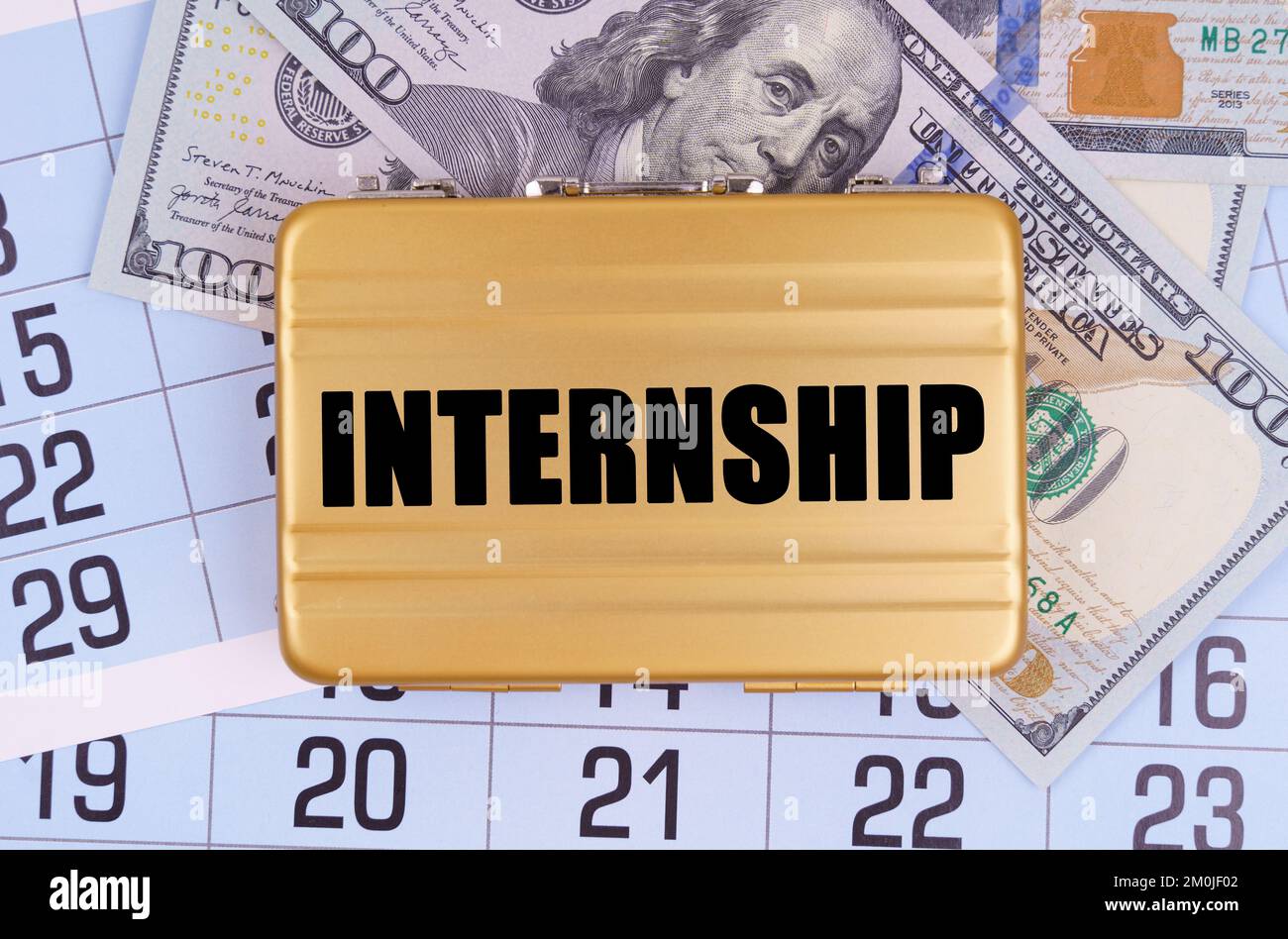 Business and finance. On the table lies a calendar, money and a briefcase with the inscription ...