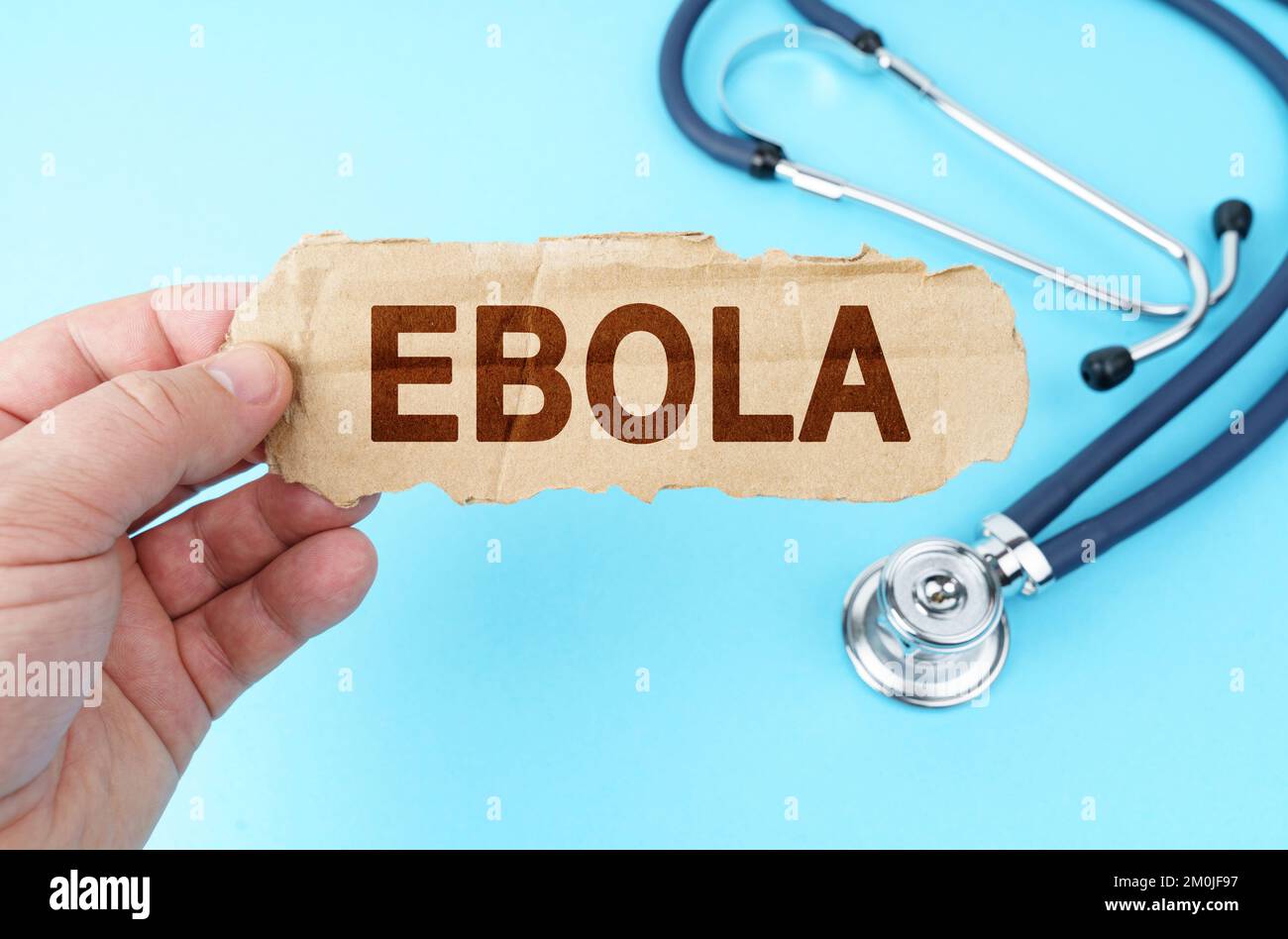 Medicine and health concept. On a blue background, a man holds a ...