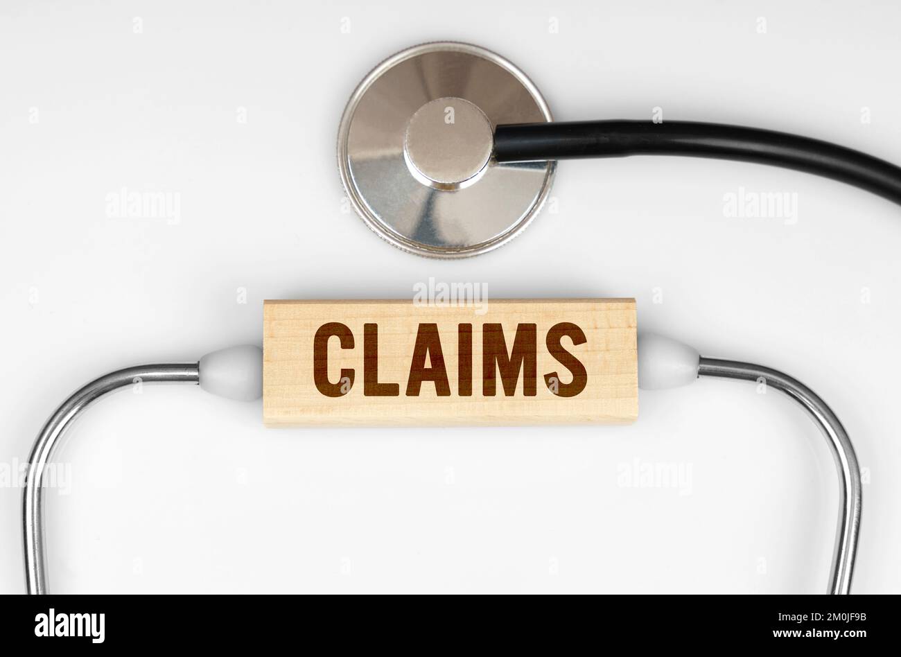 Health and medicine concept. On the table is a stethoscope and a wooden ...