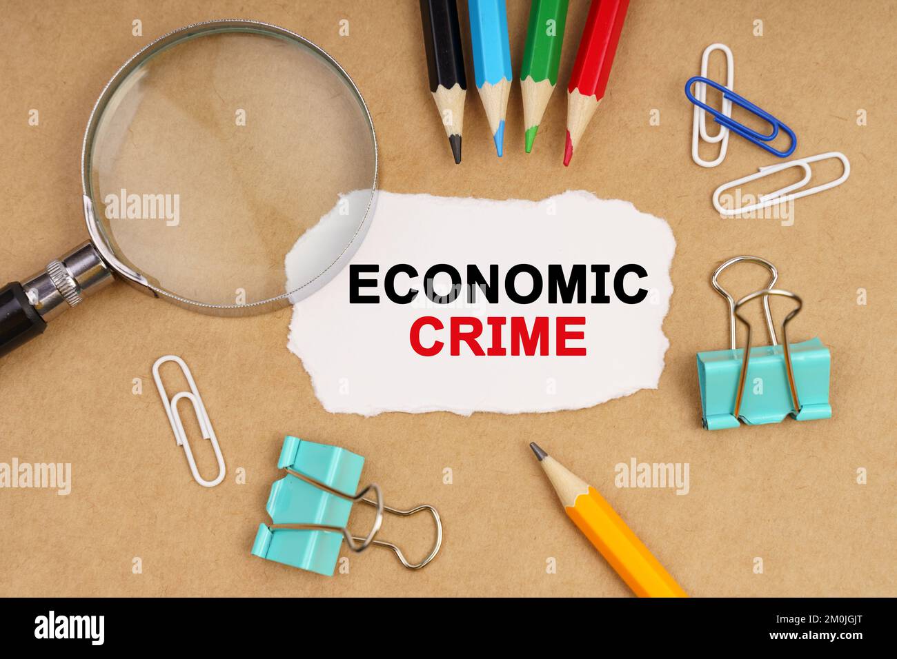 Business concept. On the table are pencils, paper clips, a magnifying ...