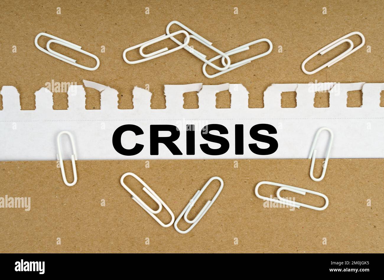 Business concept. On cardboard, white paper clips and a sheet from a ...