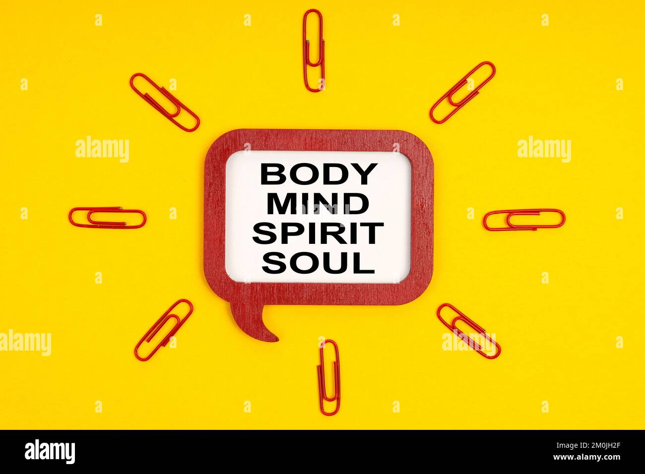 People and sport concept. On a yellow background, paper clips and a ...