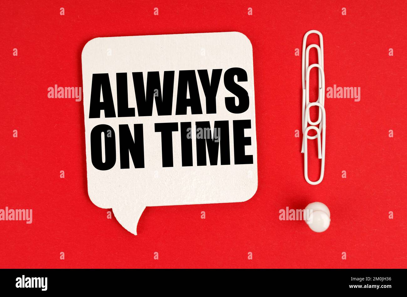 Business concept. On a red background, paper clips are an exclamation ...