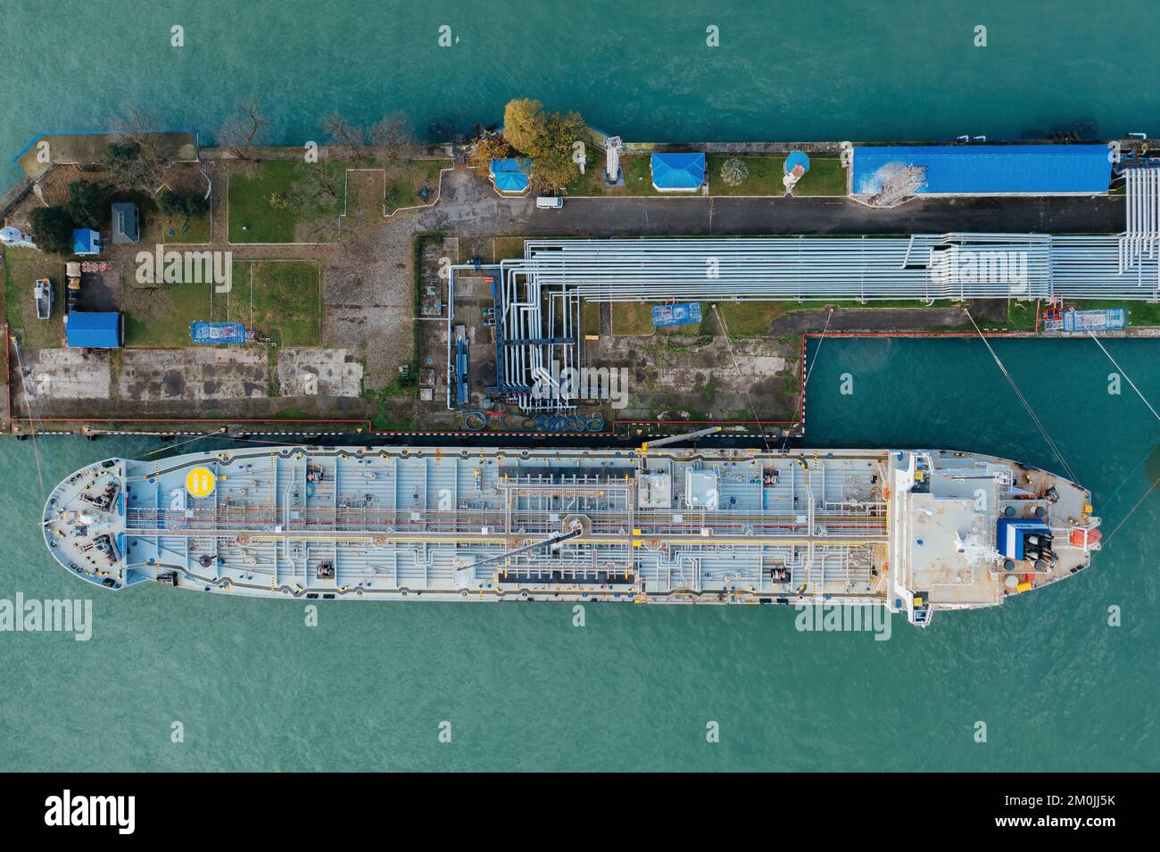 Ship tanker with LPG. Process of loading of tanker, drone aerial view ...