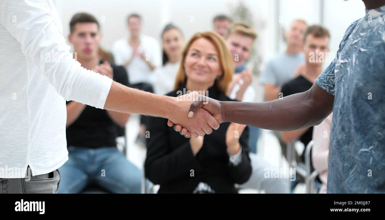 Group shake hands speaker hi-res stock photography and images - Alamy
