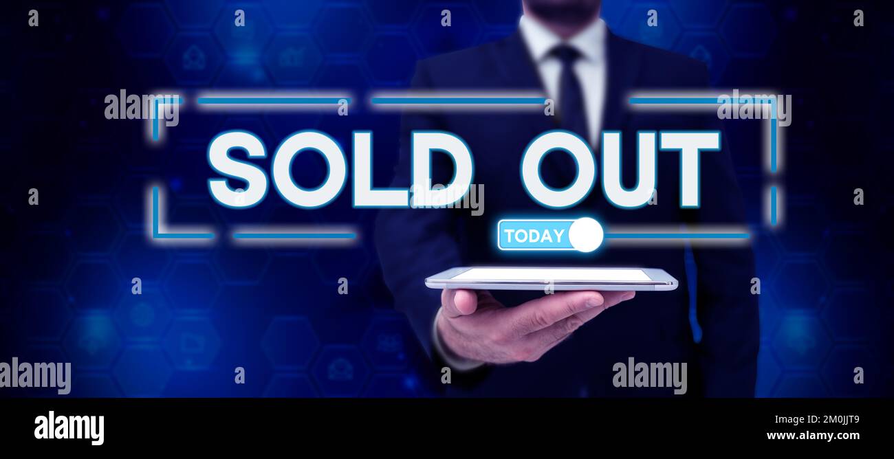 Hand writing sign Sold Out. Word Written on Not available anymore ...