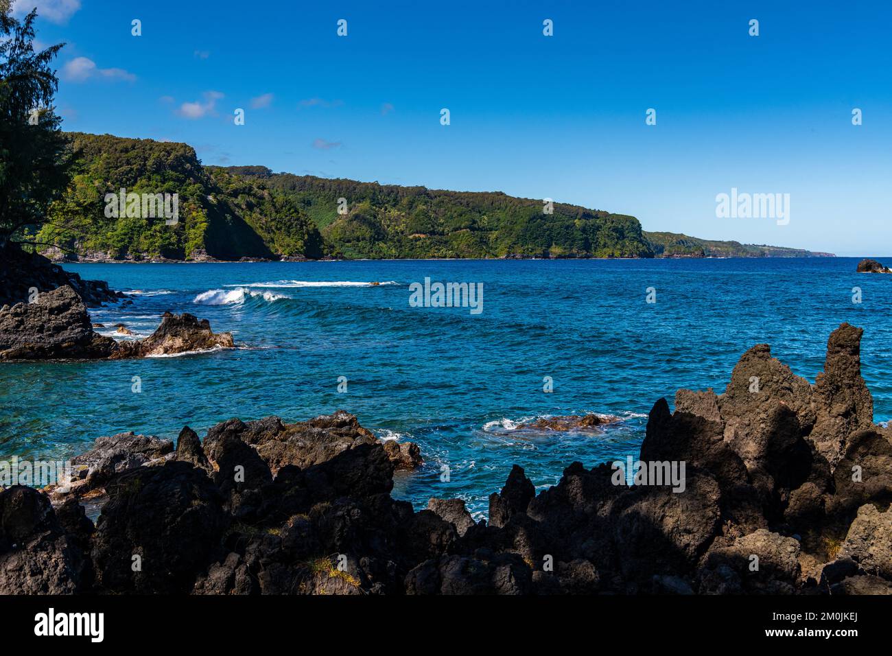 Volcanic rock along the shoreline of the Keanae Peninsula in Maui ...