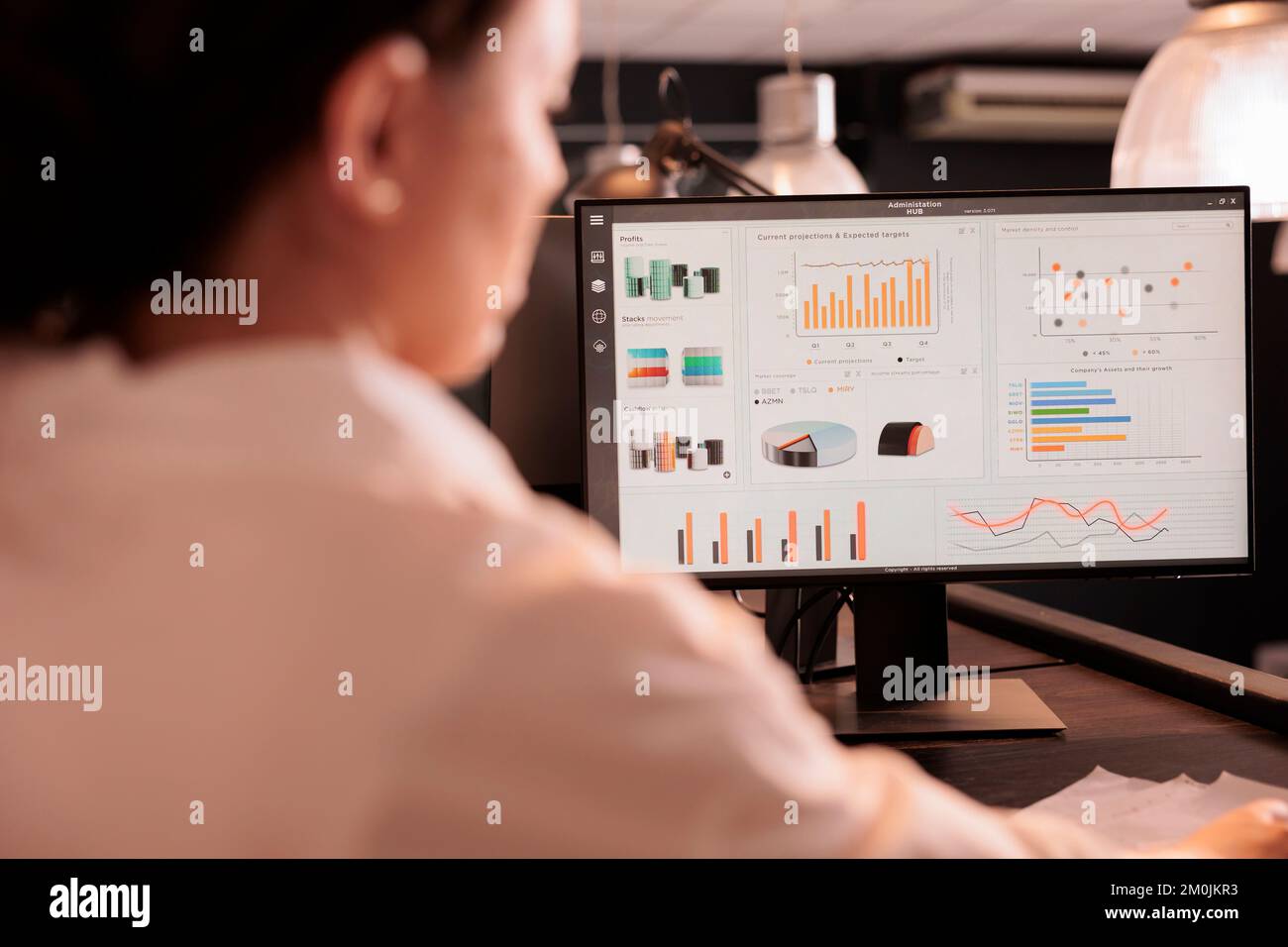 Woman analyzing company marketing project revenue statistics on ...