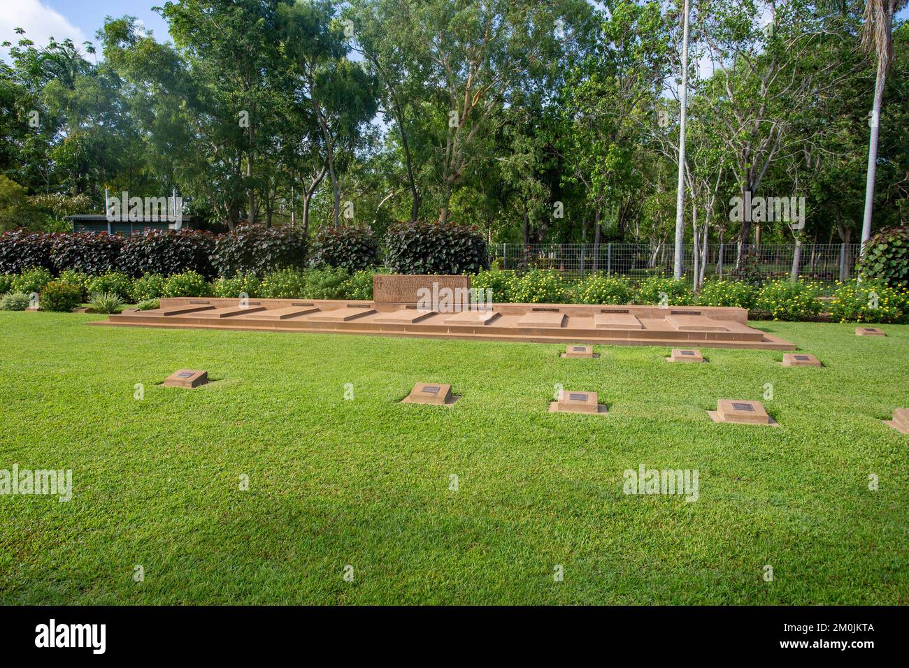 View of the common grave with low set memorial to Darwin Post Office ...