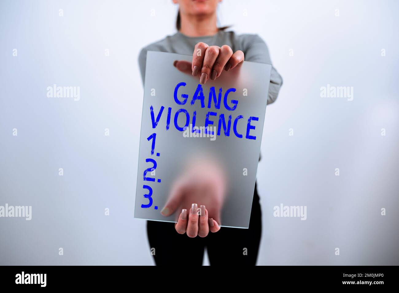 Hand writing sign Gang Violence. Word Written on infringement of the ...