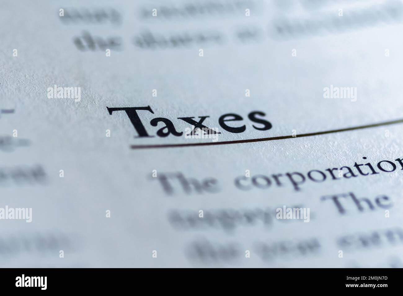 The word Taxes written in legal business law textbook Stock Photo - Alamy
