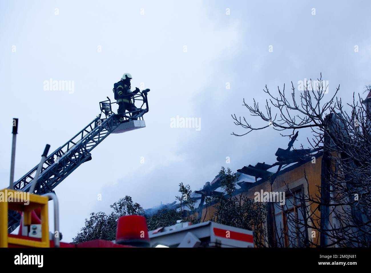 Firefighters fighting the fire Stock Photo - Alamy