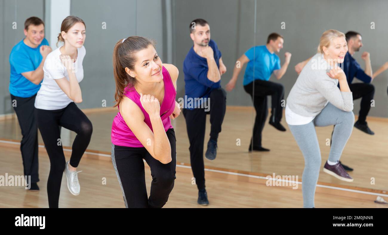 Woman training at group dance class Stock Photo - Alamy
