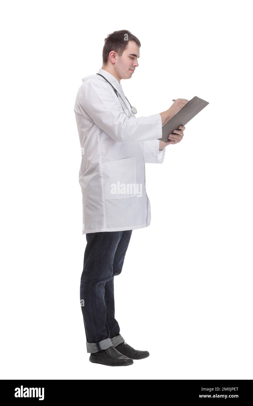 Happy smiling doctor writing on clipboard Stock Photo - Alamy