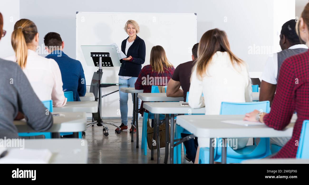 Female speaker giving presentation for students Stock Photo - Alamy