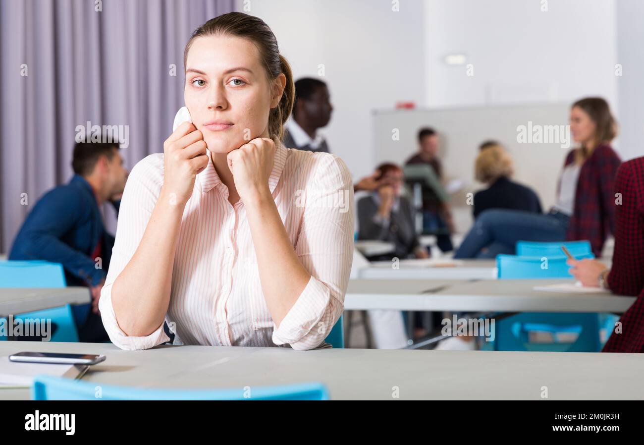 Frustrated woman student in classroom Stock Photo - Alamy