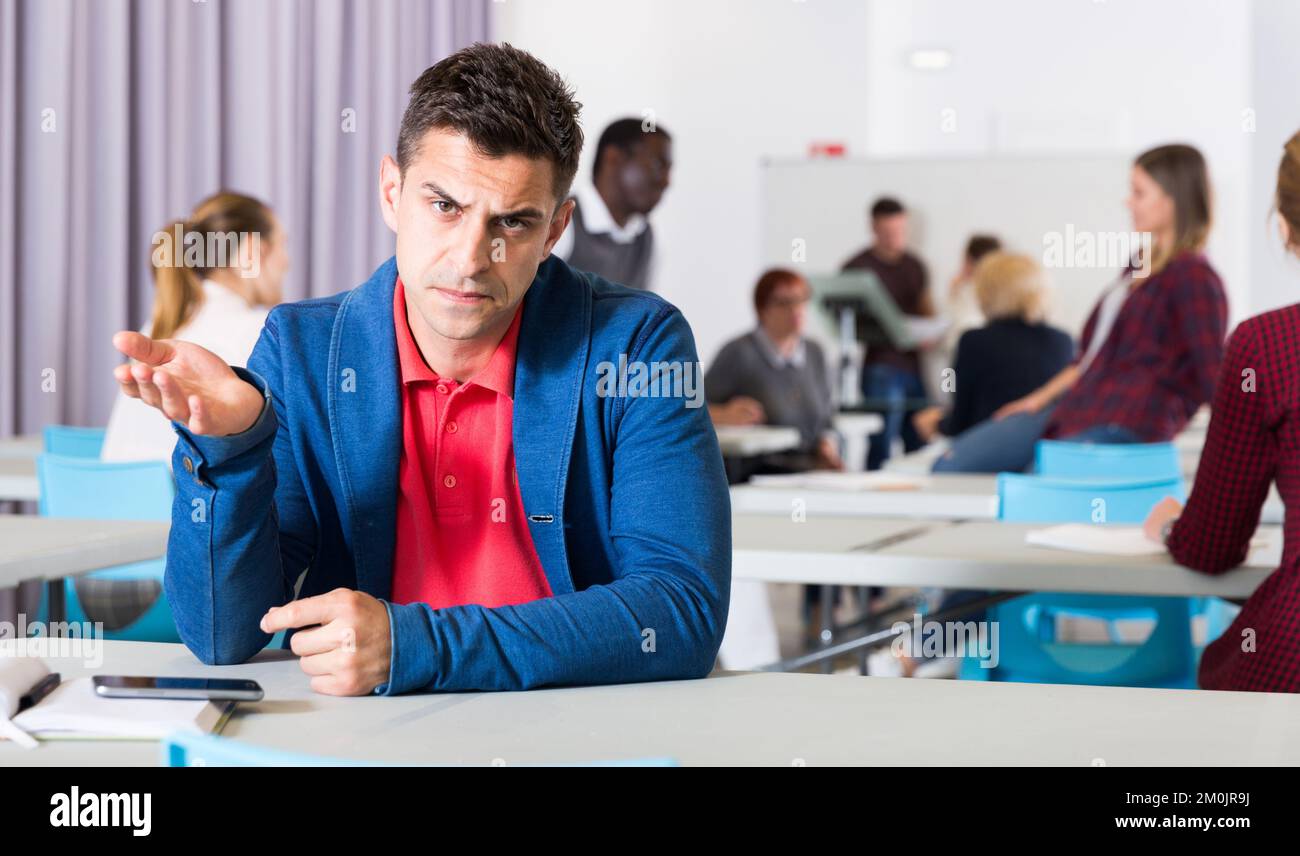 Unhappy guy in class Stock Photo - Alamy