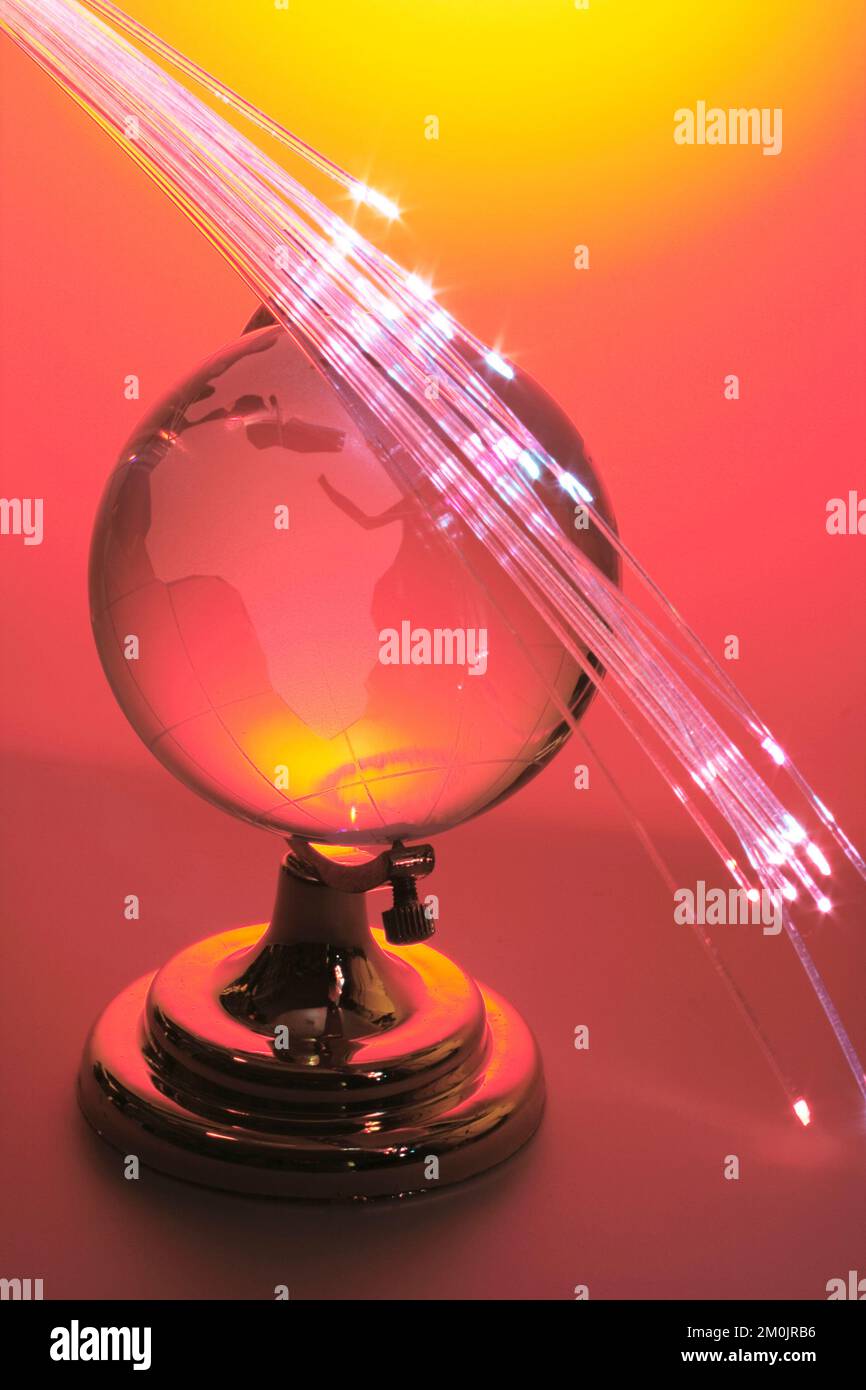 Desk Globe with Optic Fibres on Warm Background Stock Photo - Alamy