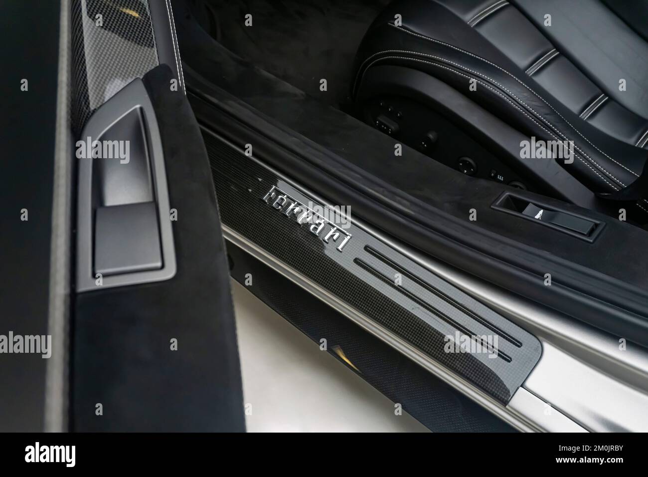 A closeup view of the carbon fiber door sill of a Ferrari 458 Stock ...