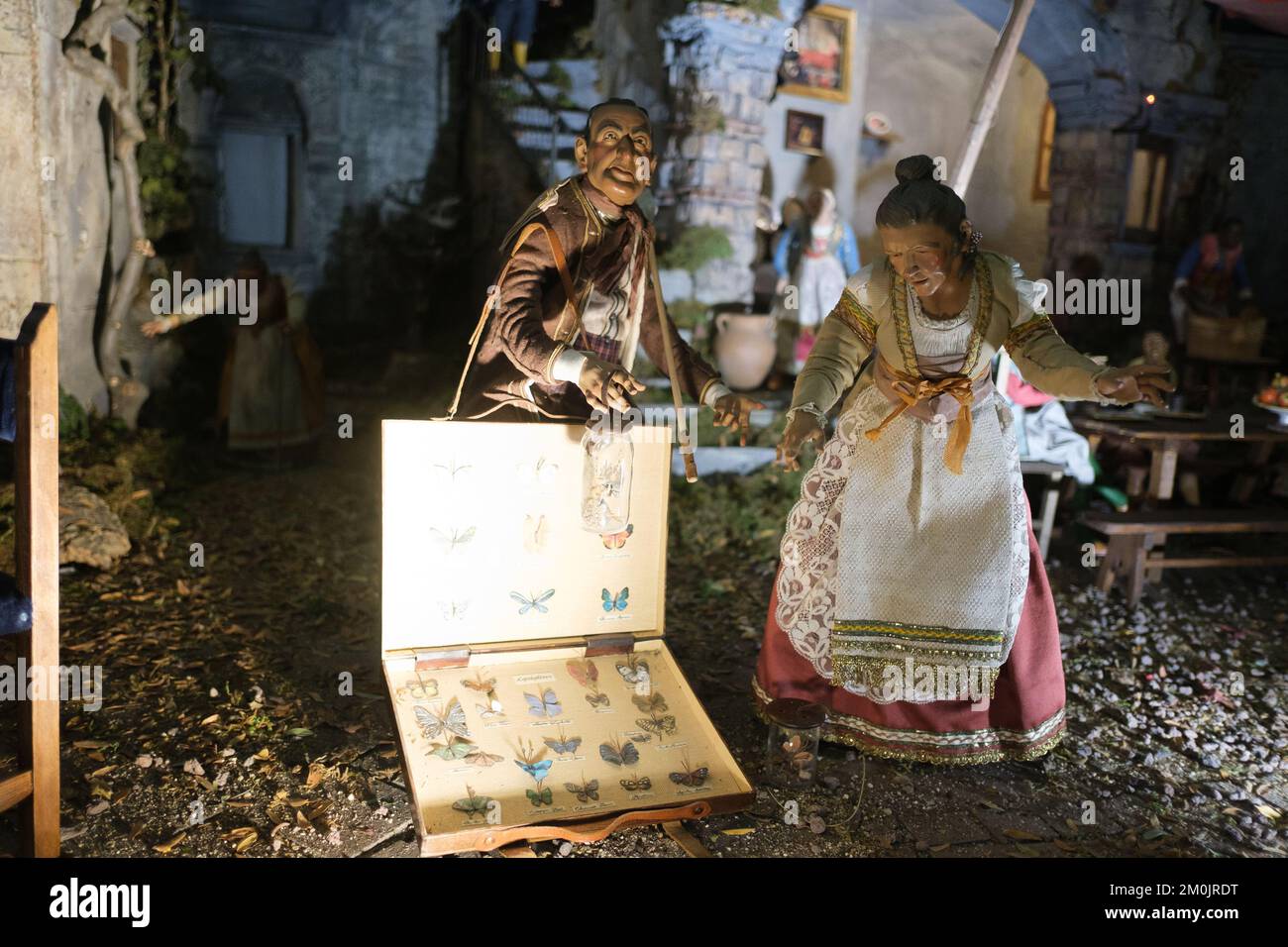 Several figures representing a scene of two merchants is shown in the ...