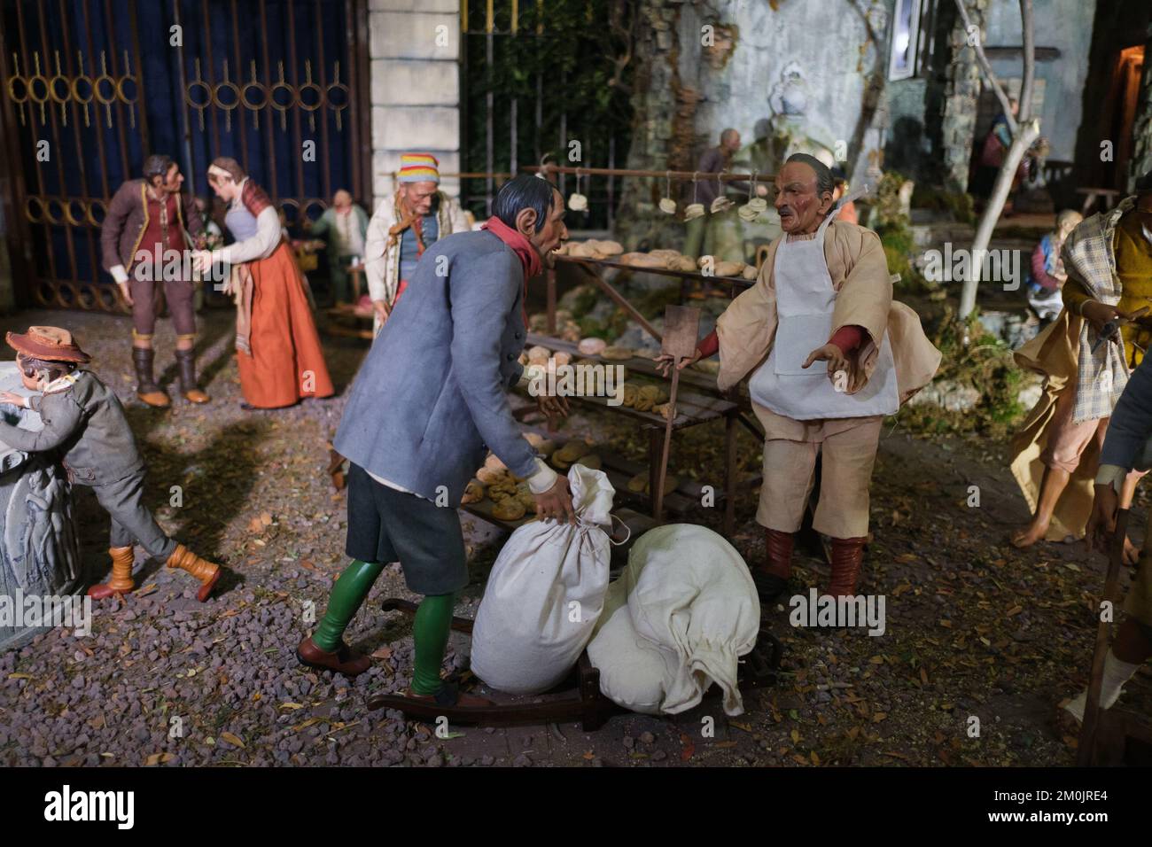 Various figures representing a scene of various merchants are shown in ...