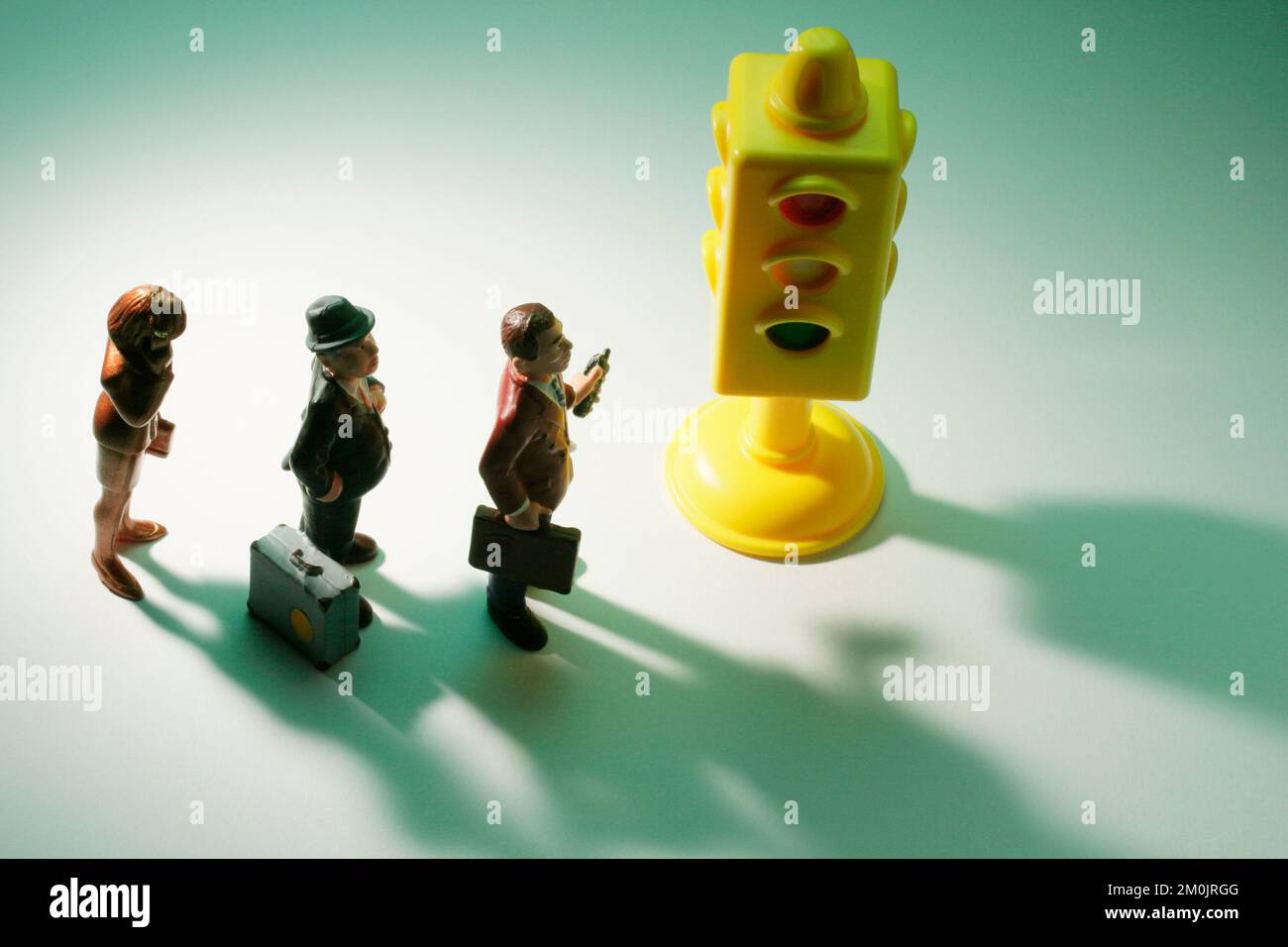Businessman Figures and Miniature Traffic Lights Stock Photo - Alamy