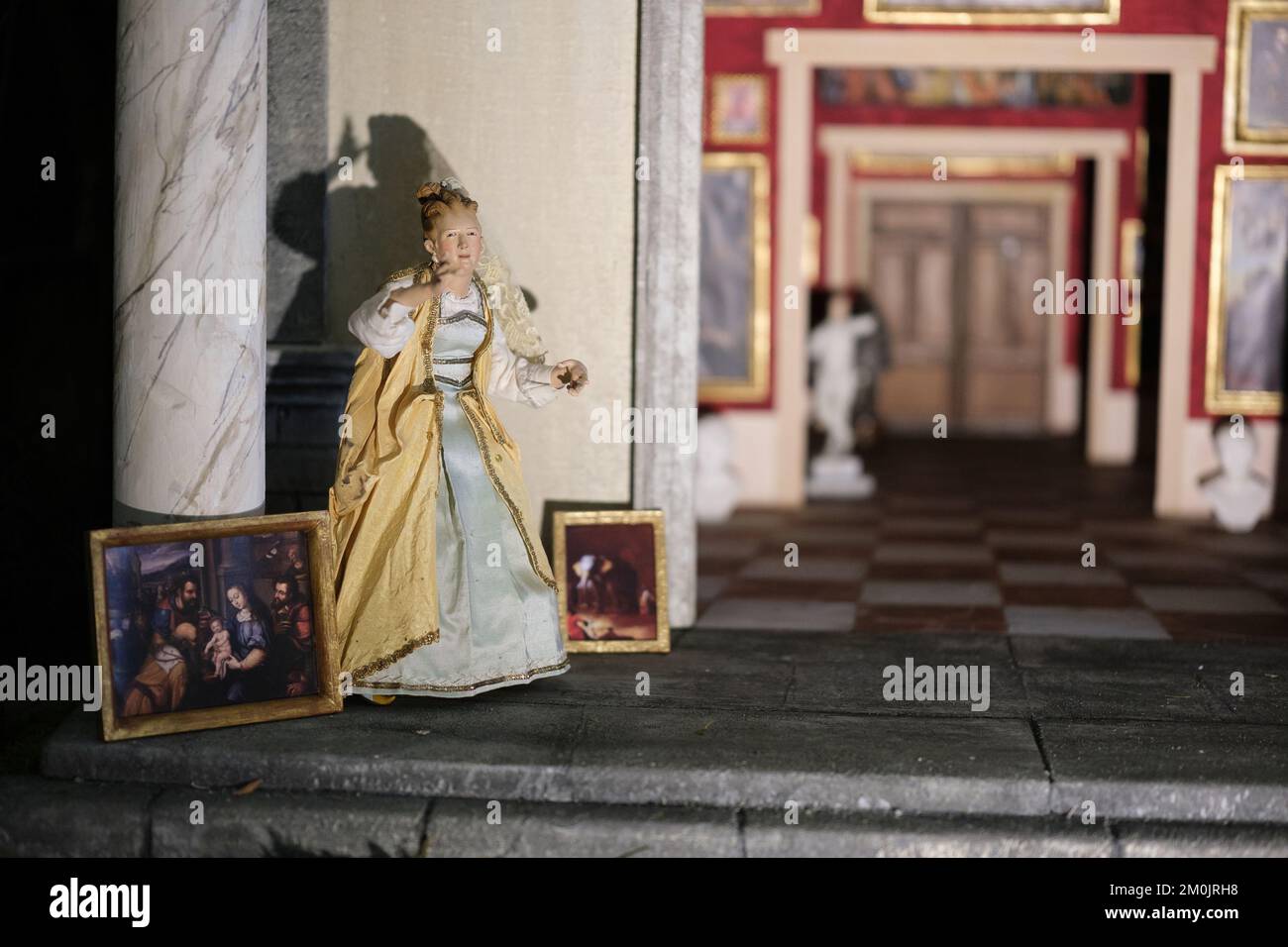 Various figures representing a scene from an art gallery are shown in ...