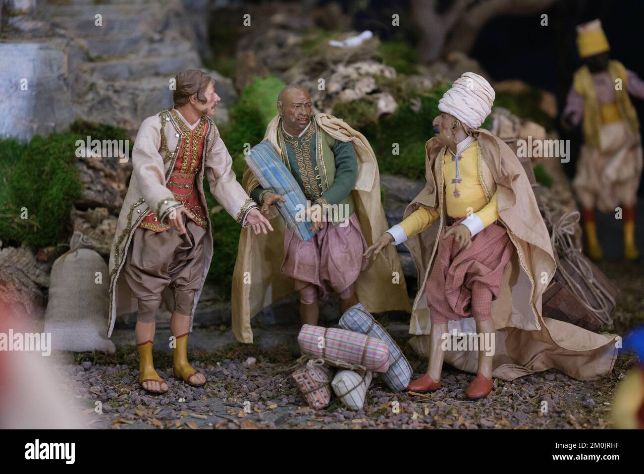 Various figures representing a scene of various merchants are shown in ...