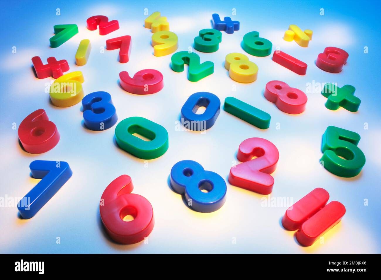 Plastic Numbers on Blue Background Stock Photo - Alamy