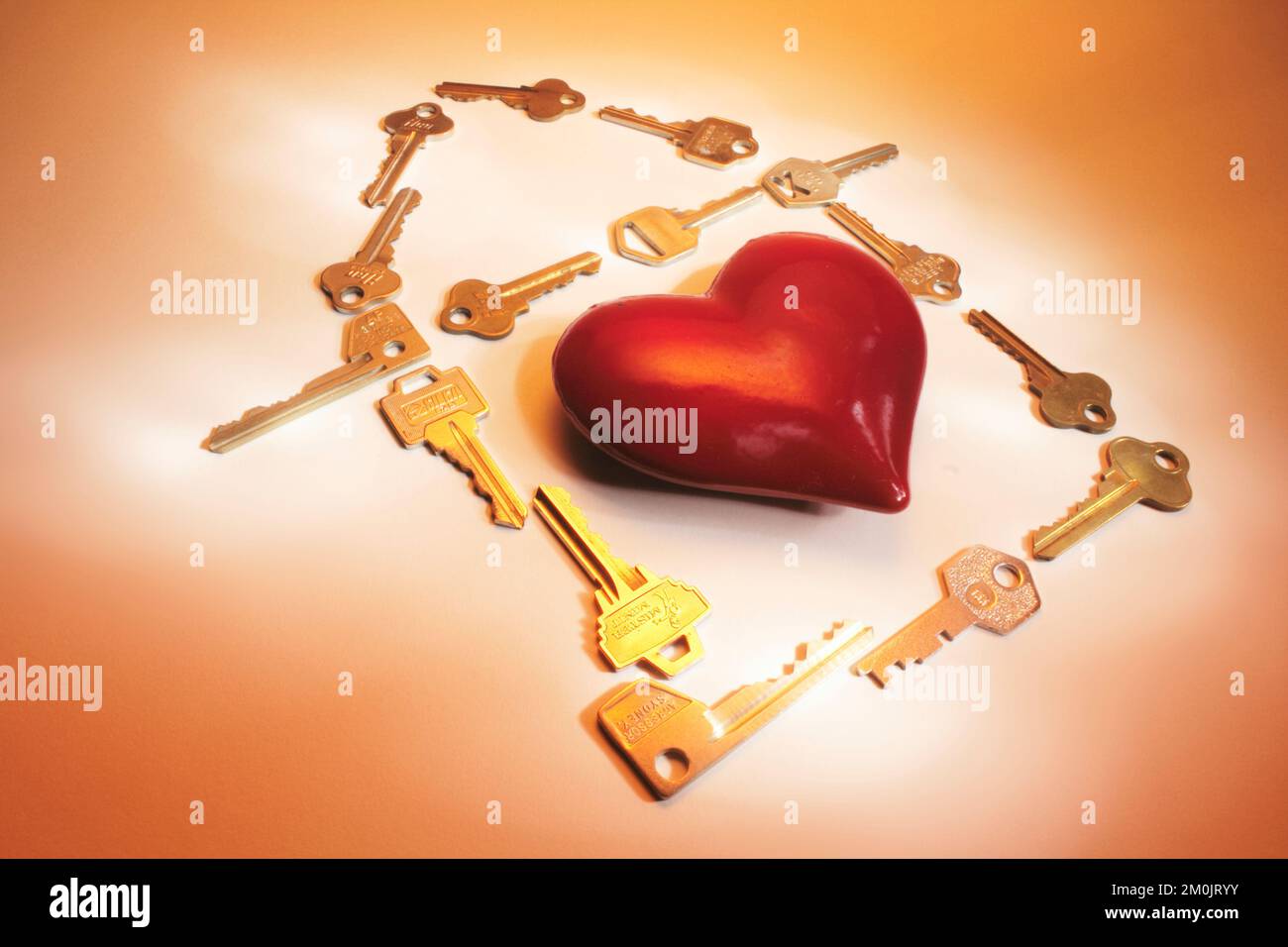 Love Heart with Keys on Warm Background Stock Photo - Alamy