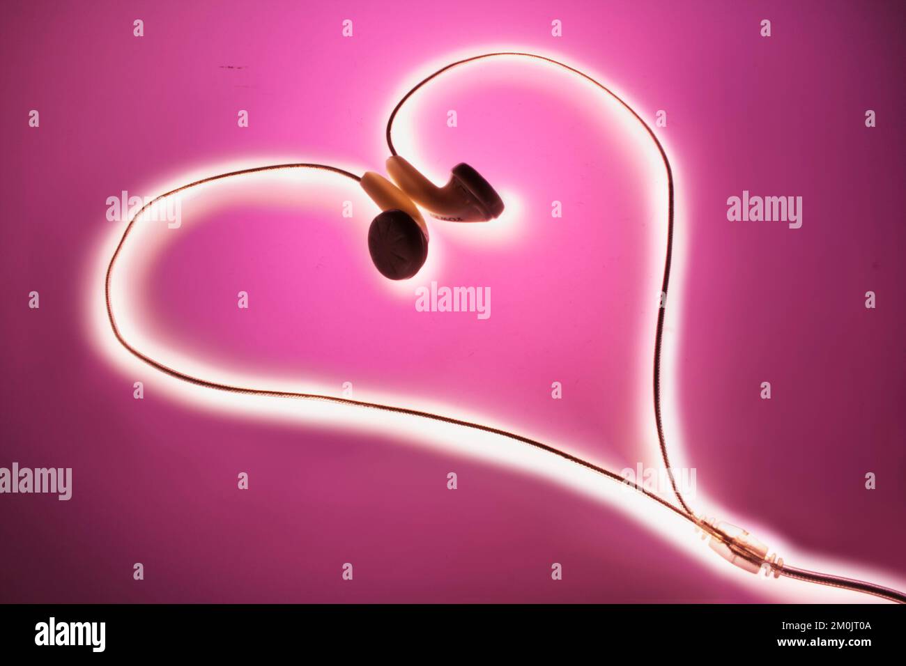 Earphone on Warm Background Stock Photo - Alamy