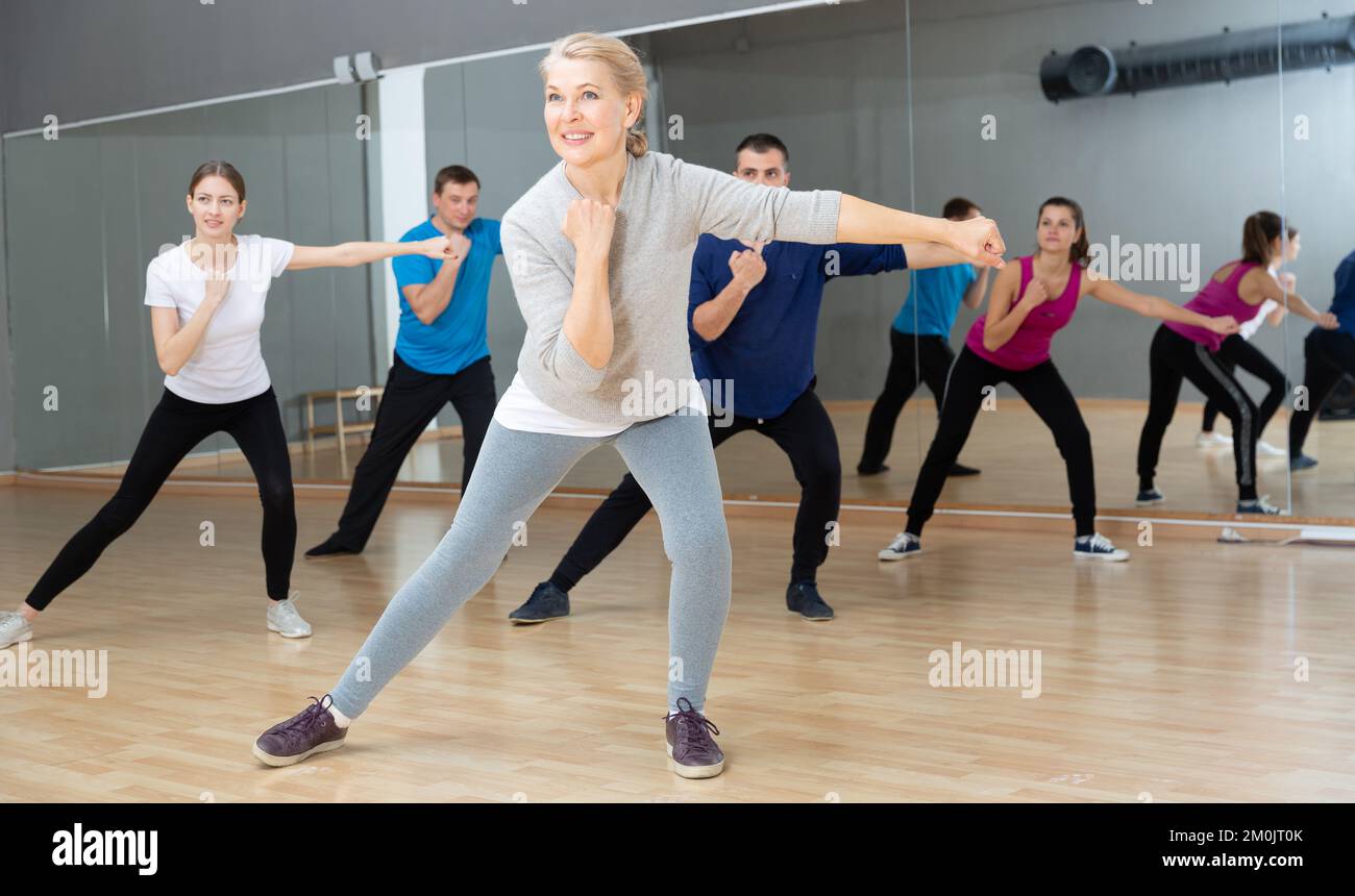 Mature woman practicing vigorous dance Stock Photo - Alamy